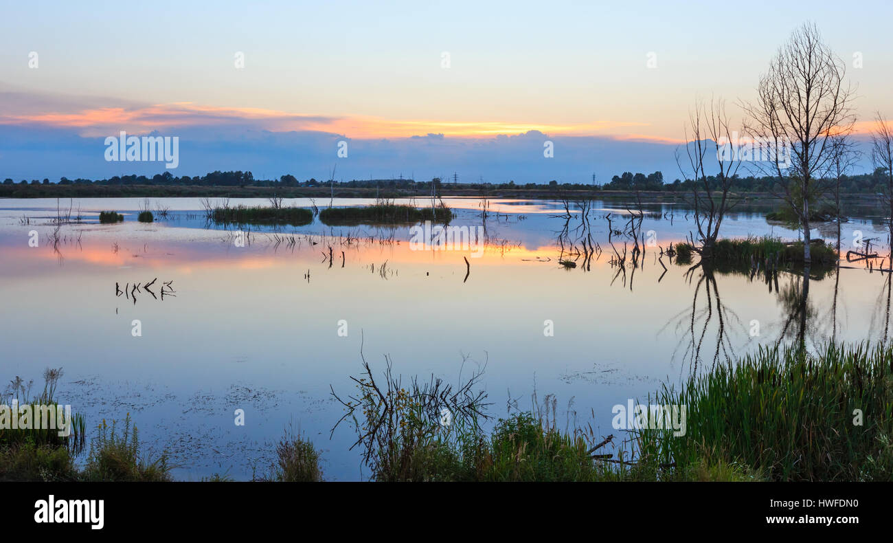 Sunset summer lake landscape with sun reflection on water surface (near ...