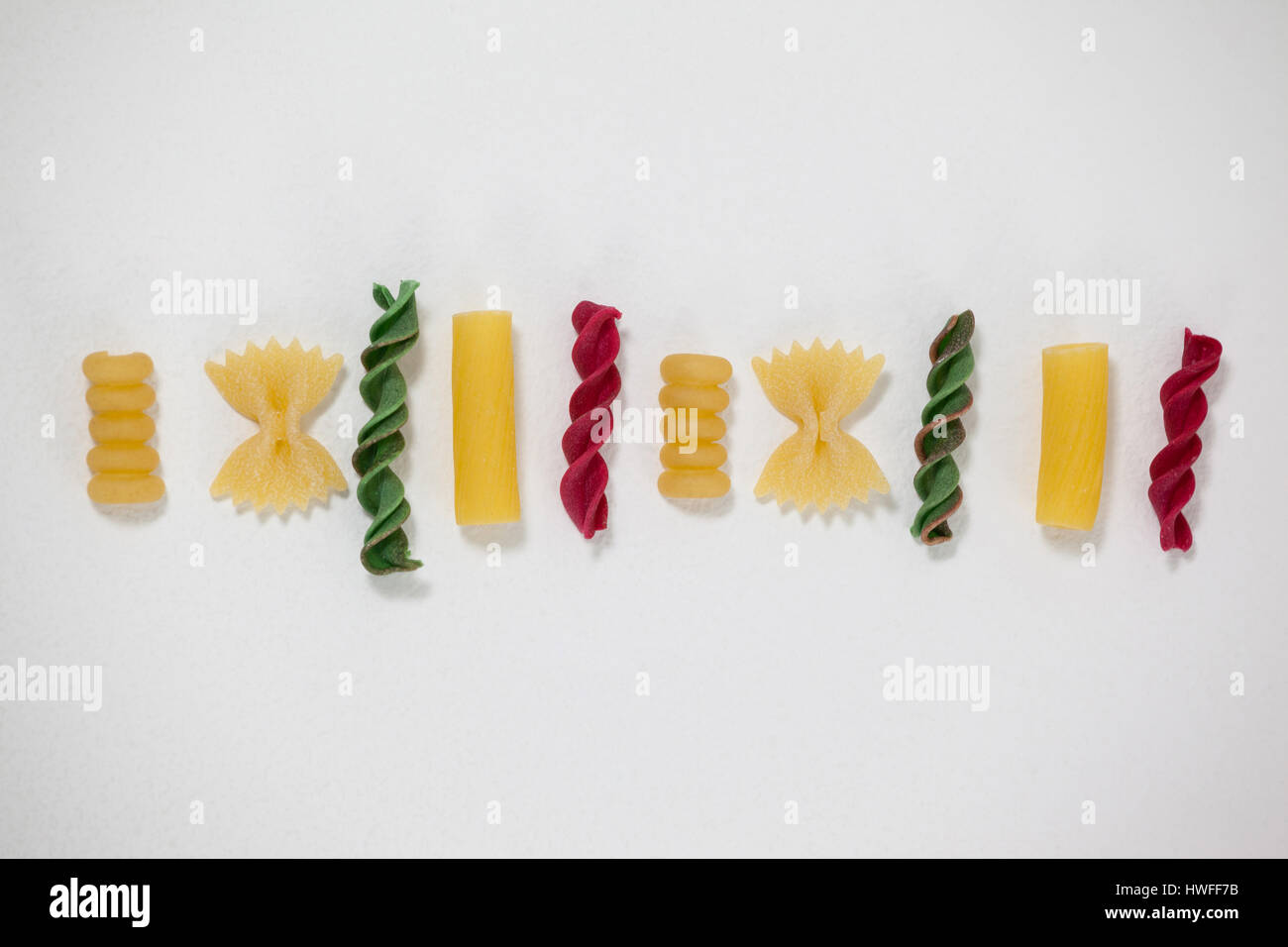 Varieties of pasta arranged on white background Stock Photo - Alamy