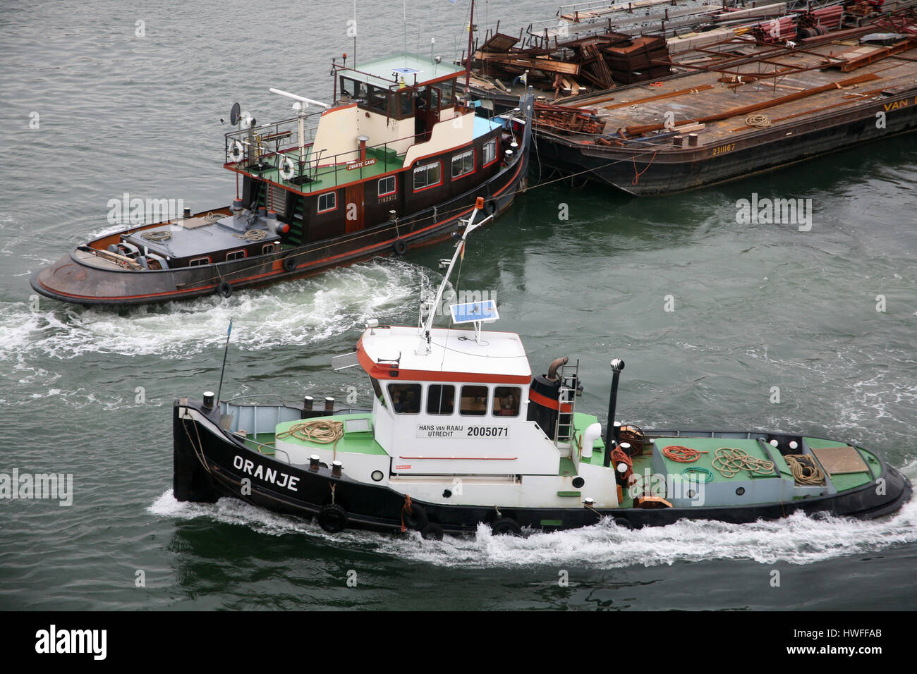 tugboat at work in rotterdam harbor Stock Photo - Alamy