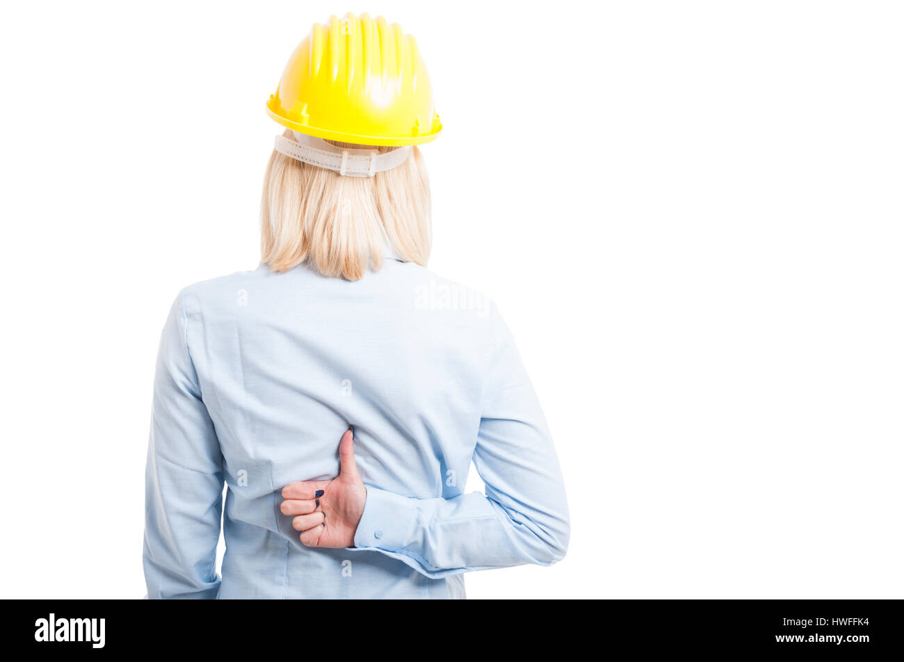 Female engineer back showing like gesture wearing yellow helmet ...