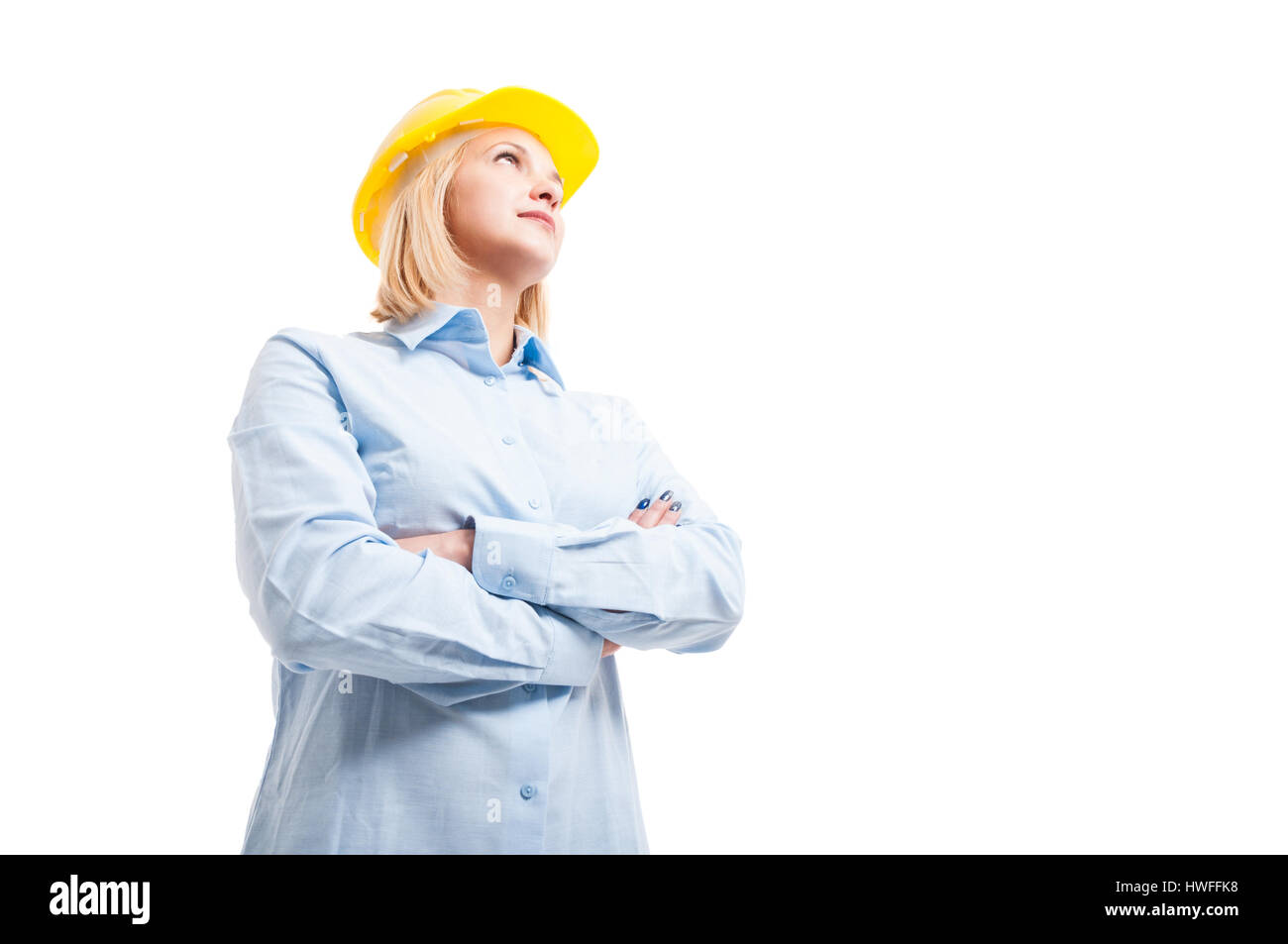 low angle hero shot of female engineer posing with arms crossed being ...