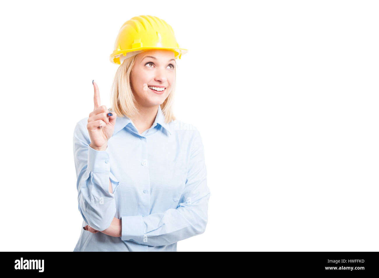 Portrait woman engineer making idea gesture looking up and smiling ...
