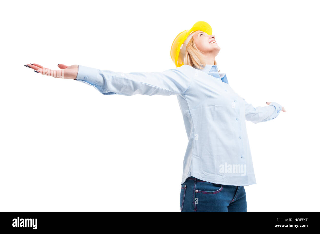 low angle hero shot of female engineer posing looking happy isolated on ...