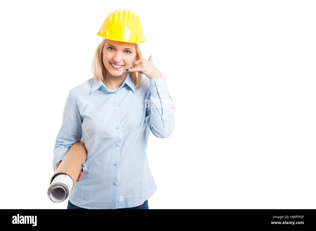 Woman architect wearing yellow helmet holding blueprints smiling and showing call me gesture ...