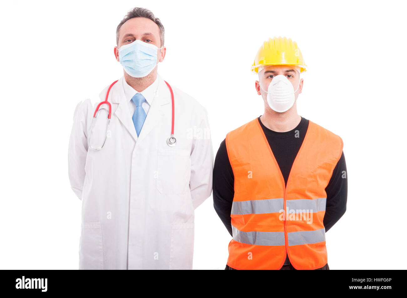 Doctor and constructor standing serious and posing studio concept ...