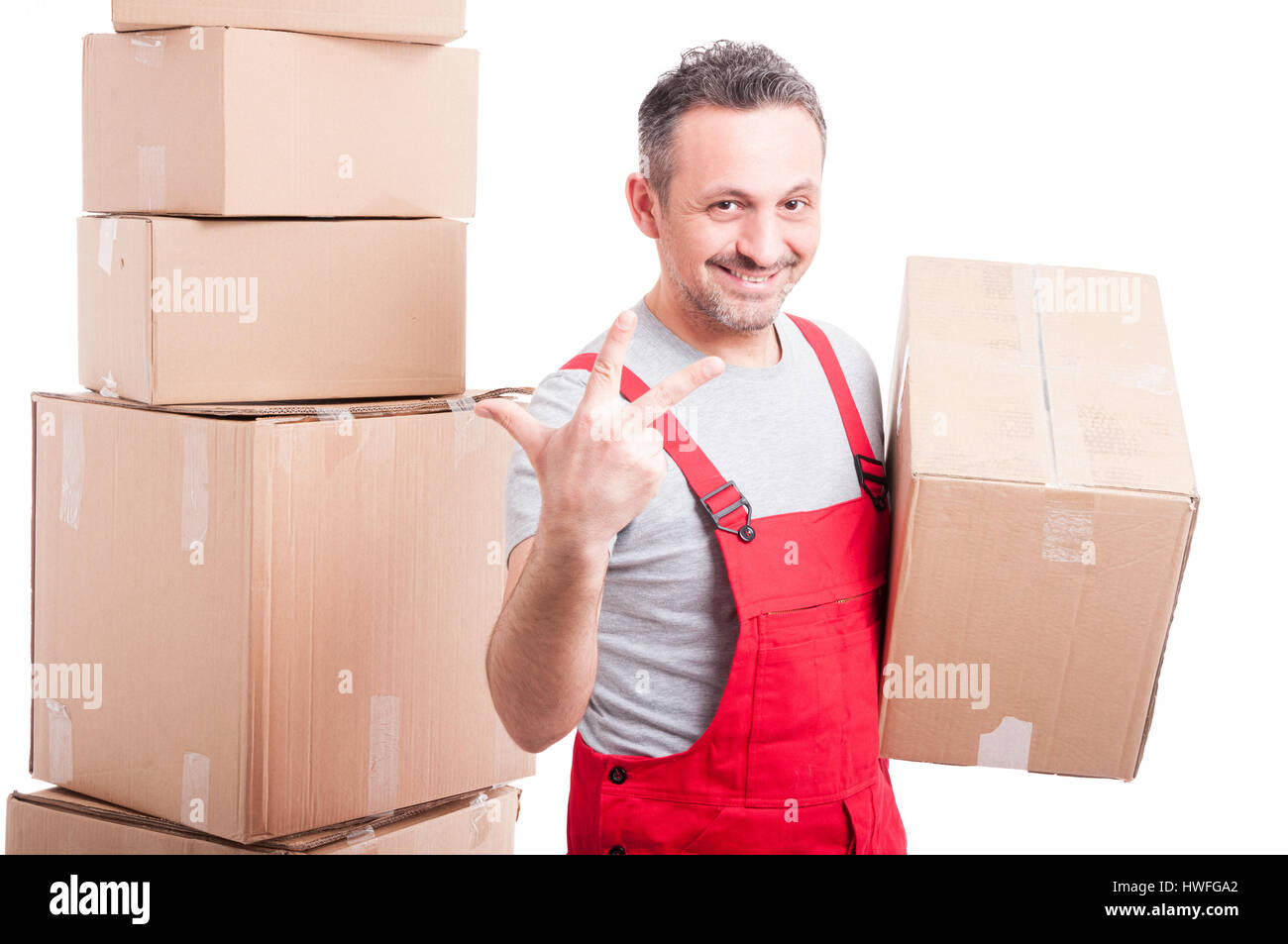 Portrait of mover guy holding box showing number three gesture and ...