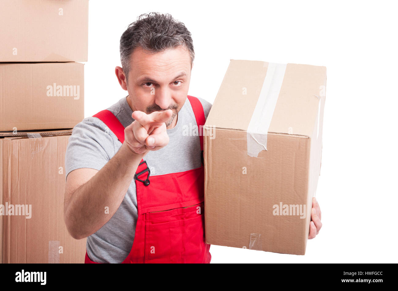Mover man holding box and showing watching you gesture isolated on ...