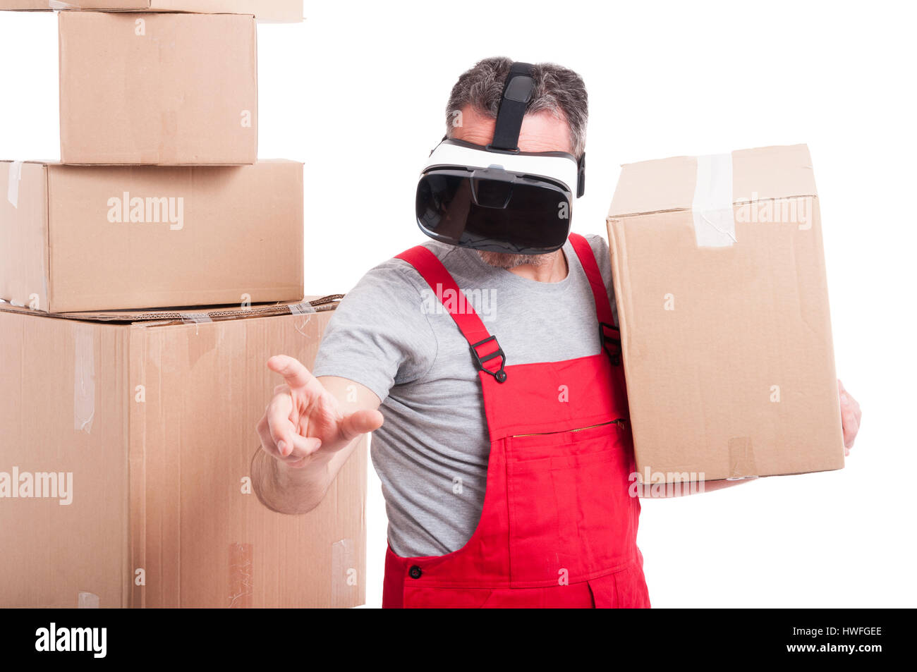 Mover man wearing virtual reality glasses holding box and grabbing ...