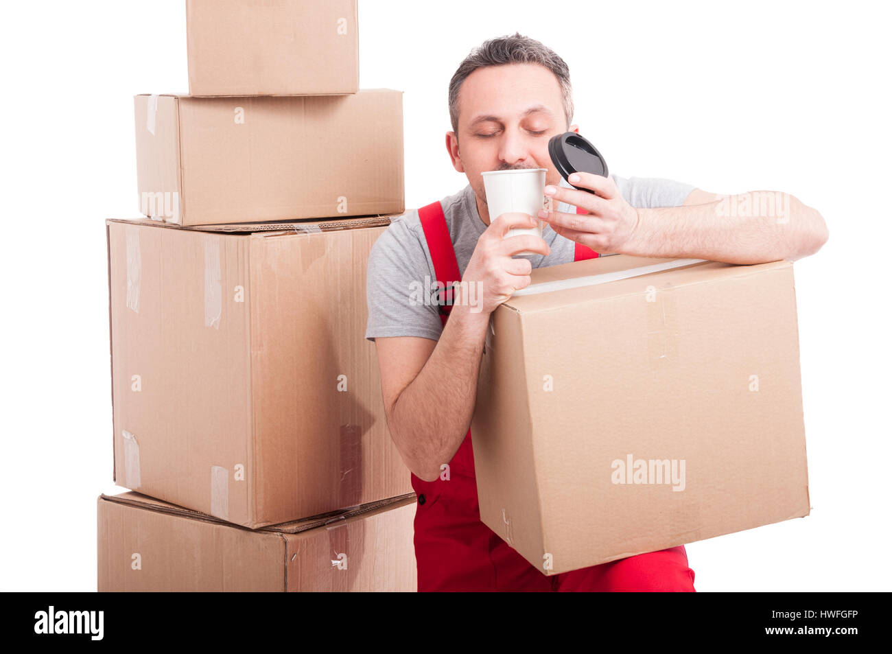 Mover guy holding box and smelling fresh coffee looking inpatient to ...