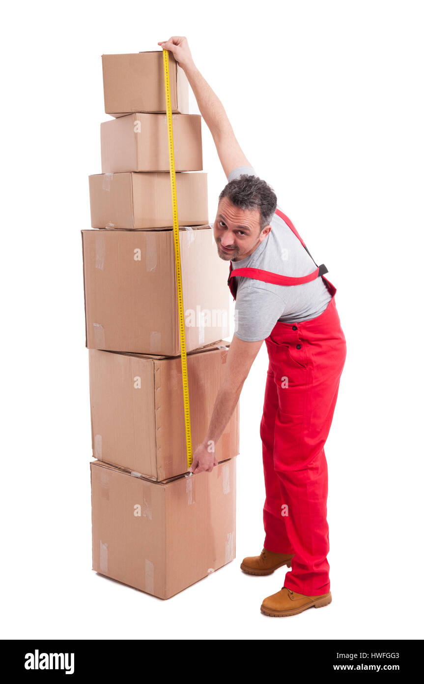Full body of mover man measuring bunch of cardboard boxes isolated on ...