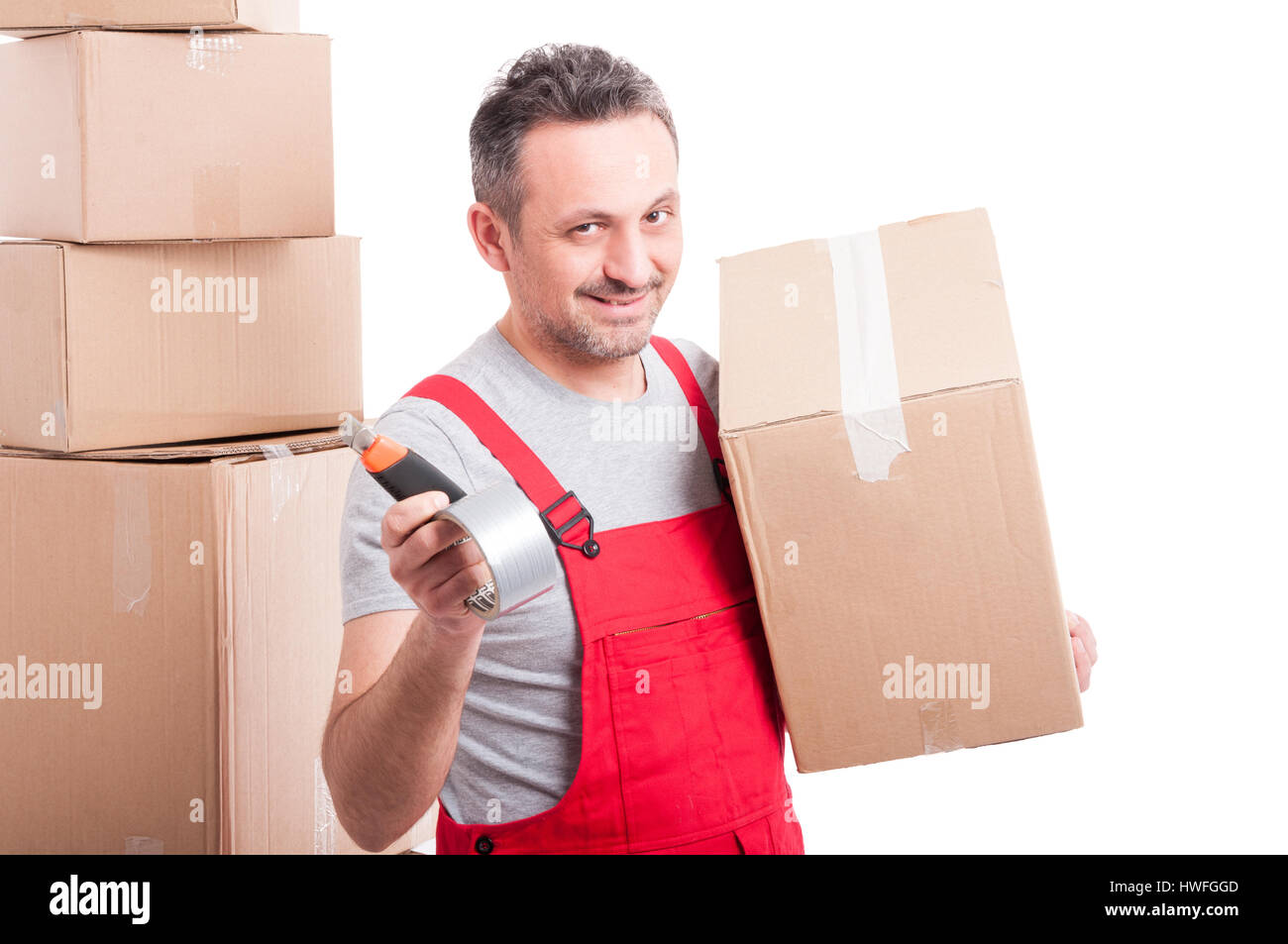 Mover man holding box cutter and duct tape and smiling isolated on ...