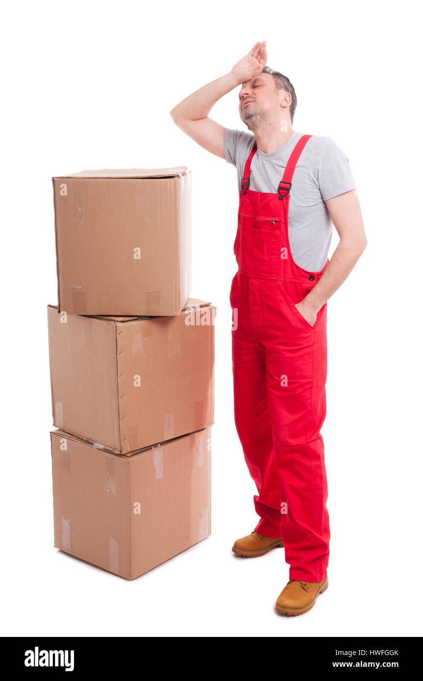 Full body of tired mover guy standing near boxes isolated on white ...