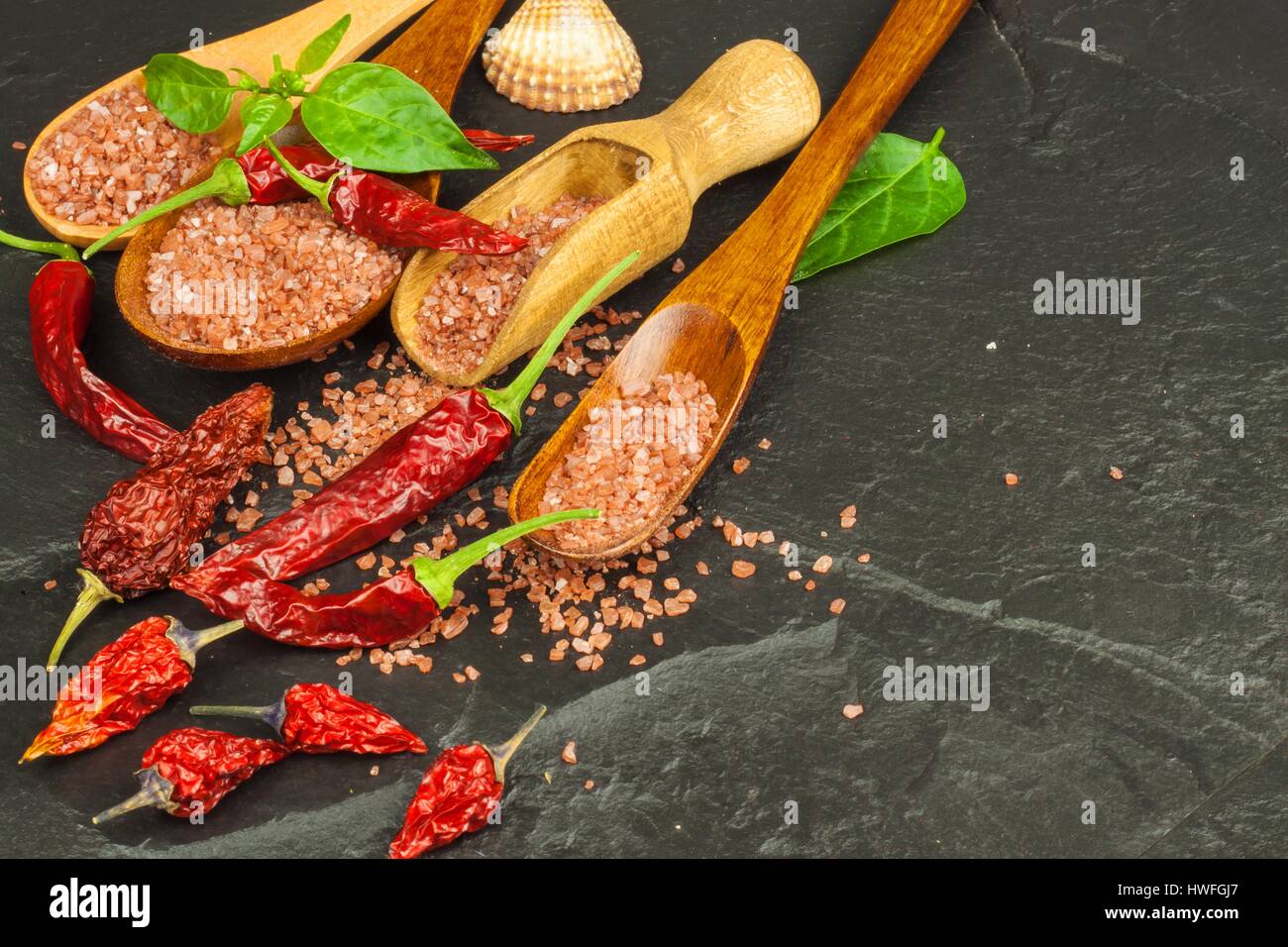 Dried chili peppers and red Hawaiian salt. Sale of spices. Advertising ...