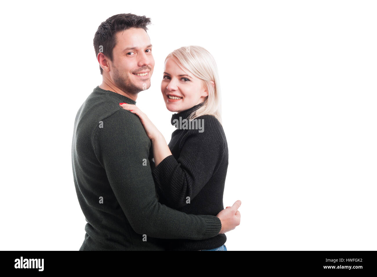 Friendly couple holding each other on white background with text space ...