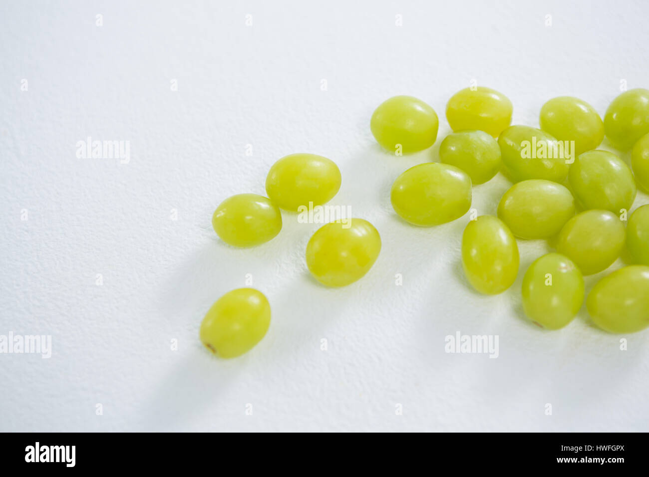 Close-up of green grapes on white background Stock Photo - Alamy