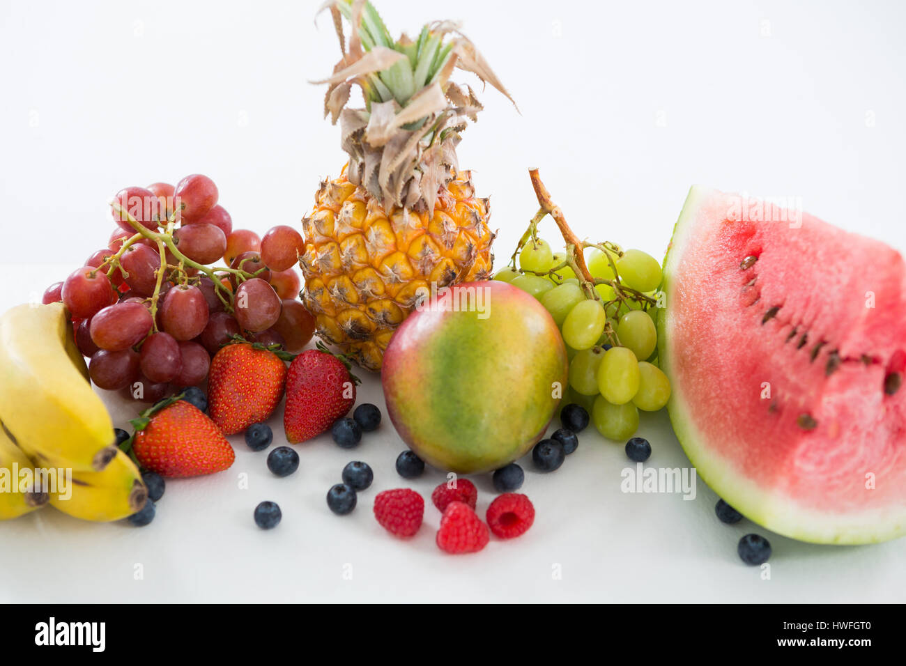 Close-up of various types of fruits on white background Stock Photo - Alamy