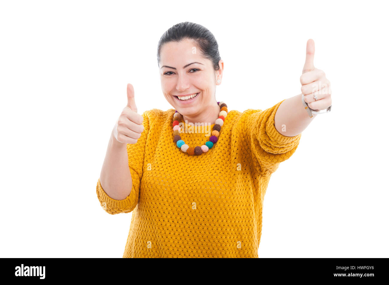 Joyful pretty lady doing double like sign with both hands on white ...