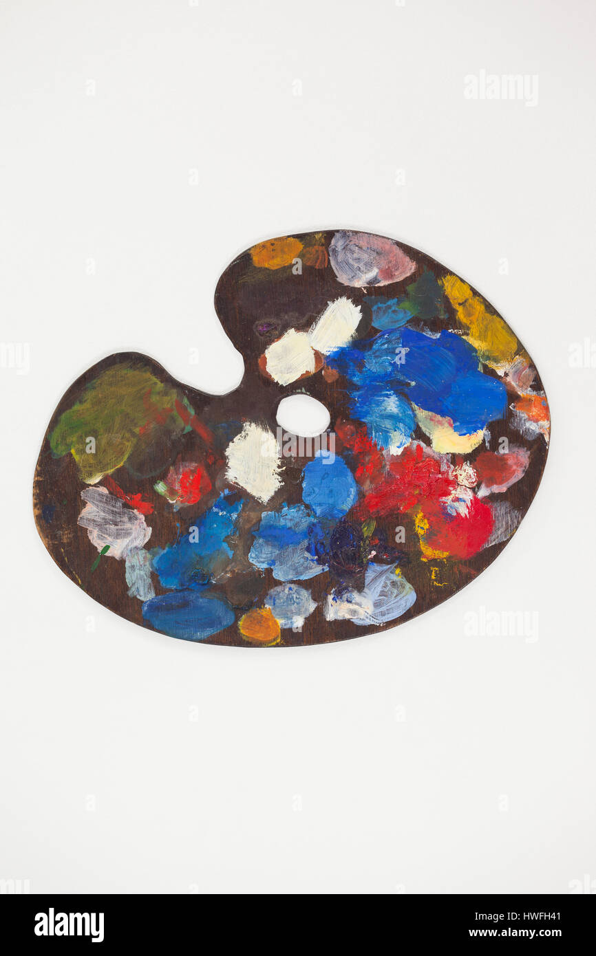 Paint palette with multiple colors against white background Stock Photo ...