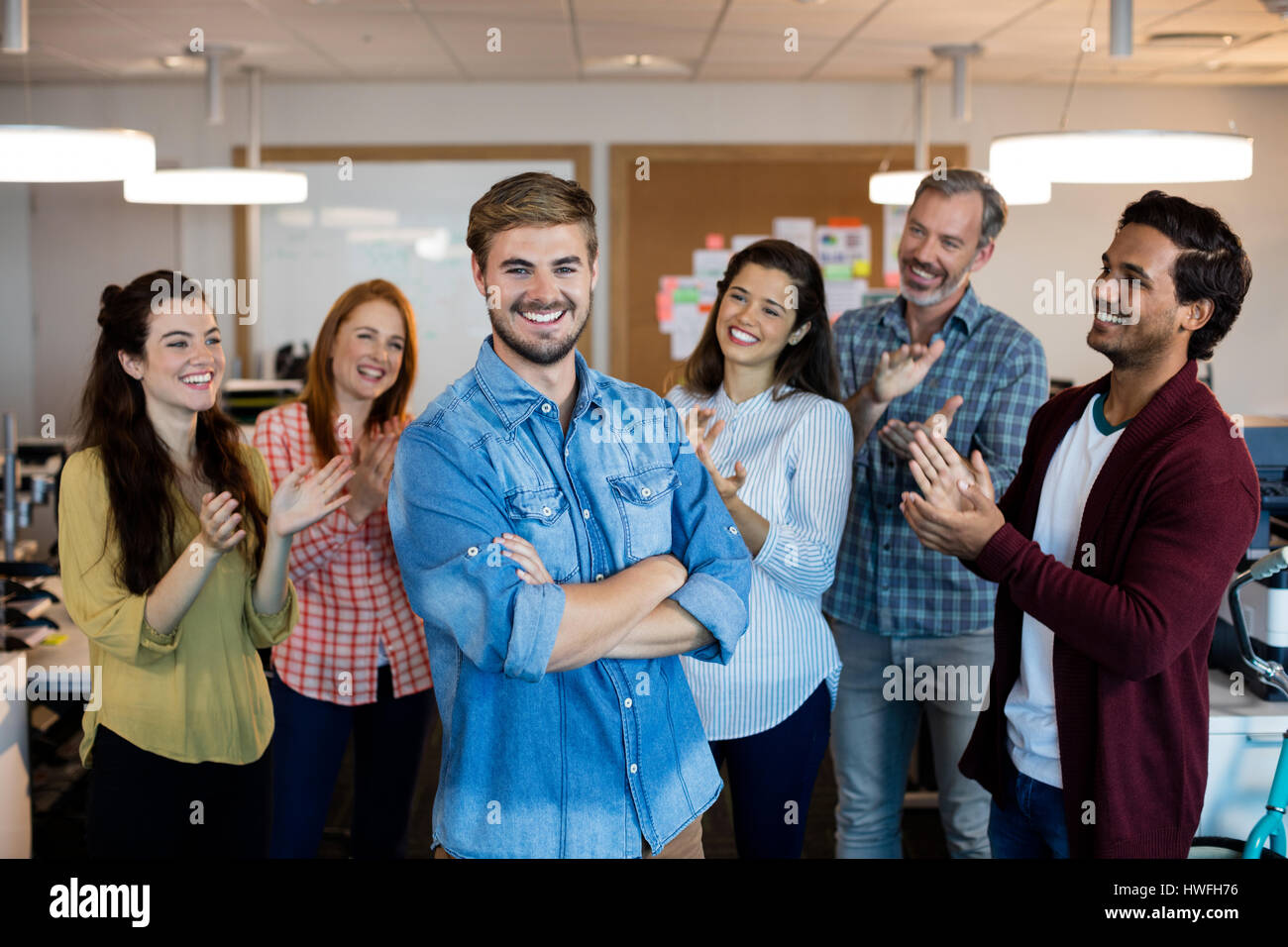 Happy creative business team celebrating success in office Stock Photo ...