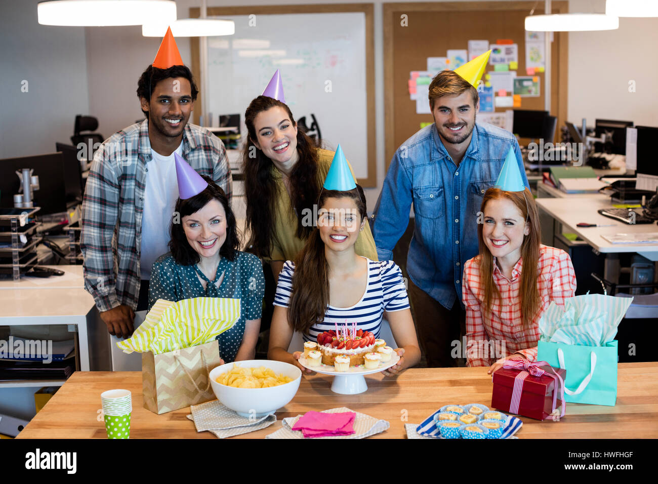 Creative business team celebrating colleagues birthday in office Stock ...