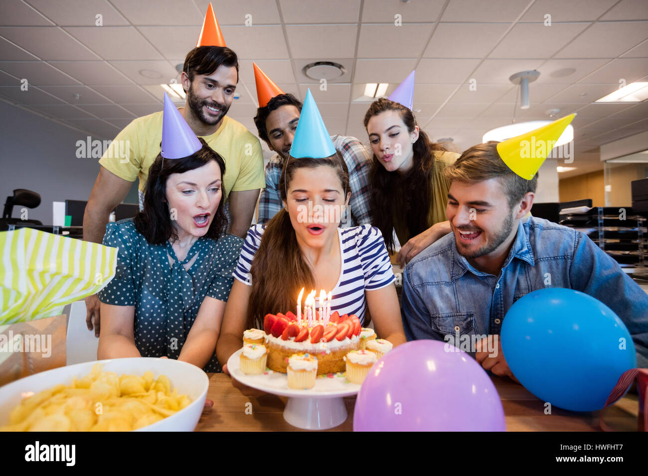 Creative business team celebrating colleagues birthday in office Stock ...