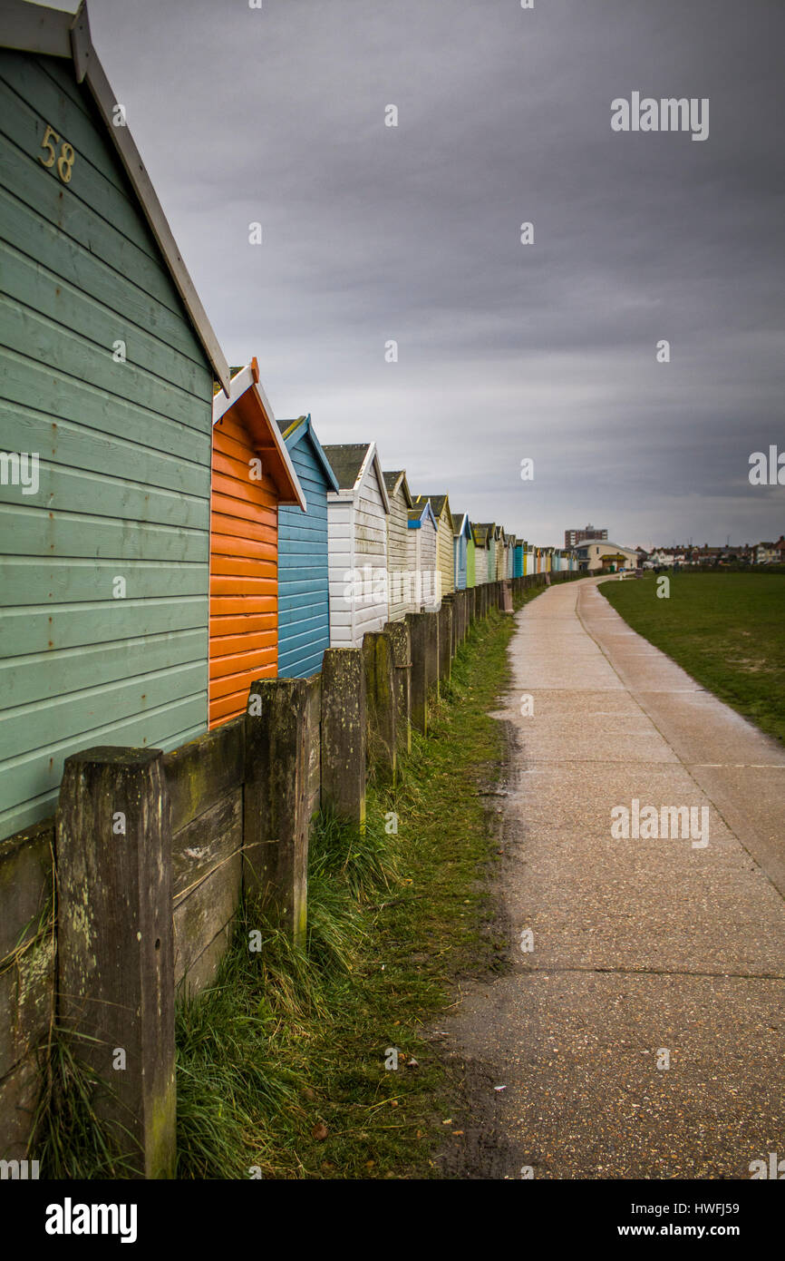 Colourful beach huts under atmospheric sky hi-res stock photography and ...