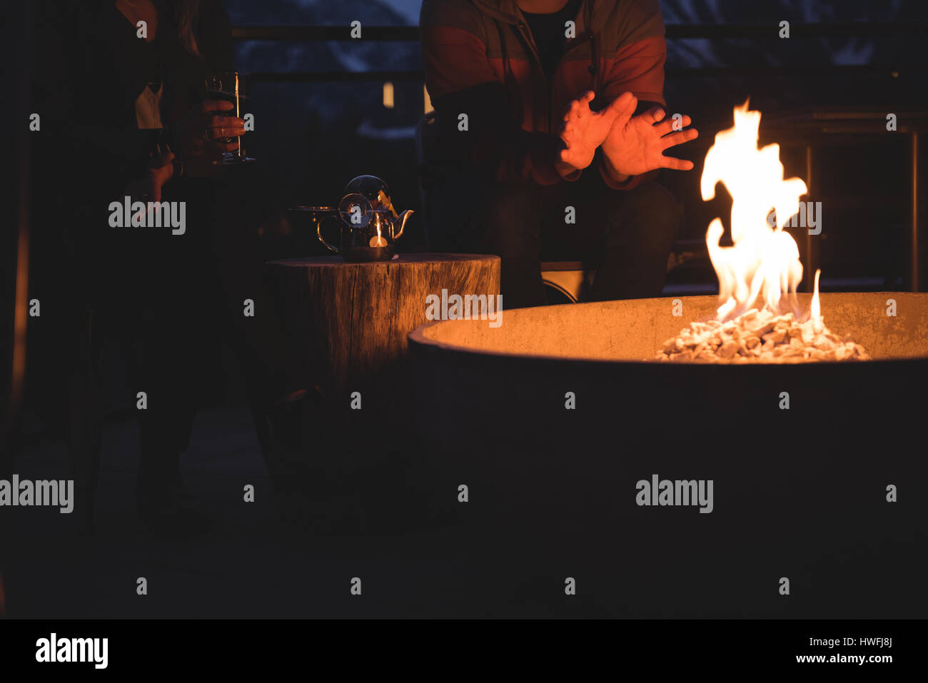 Man sitting fire drink hi-res stock photography and images - Alamy