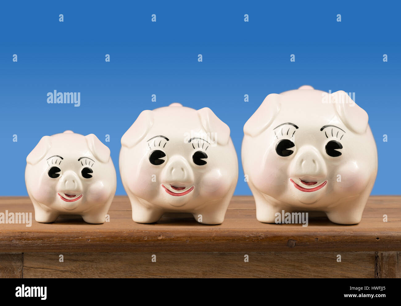 Three piggy banks hi-res stock photography and images - Alamy