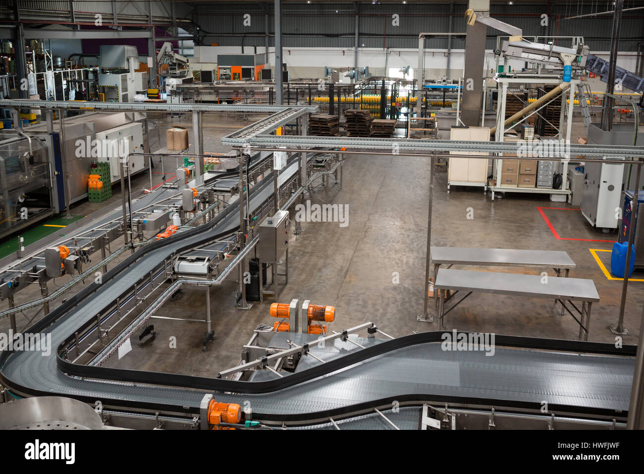 High angle view of production lines and machinery in juice factory ...