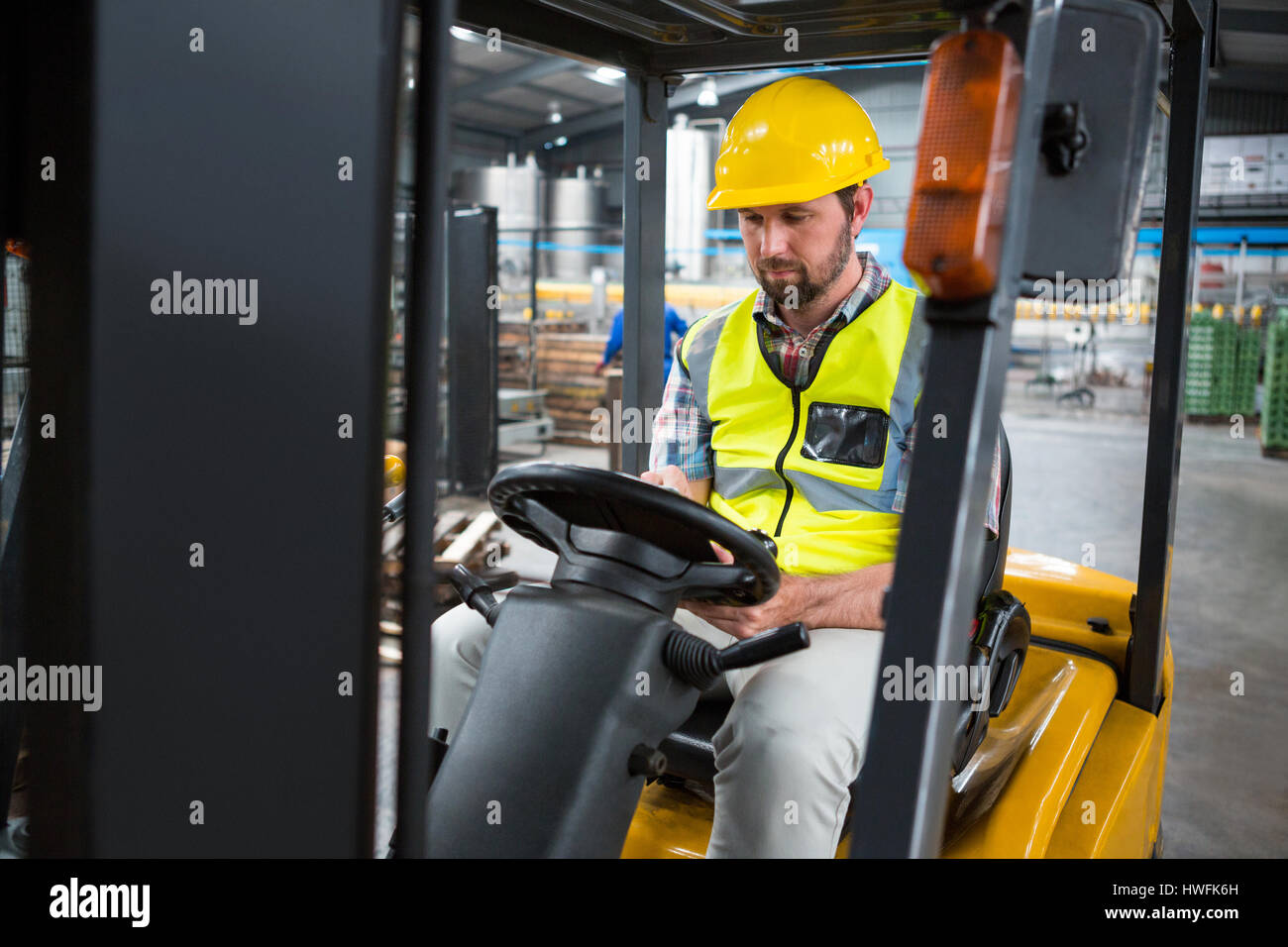 Worker sitting forklift hi-res stock photography and images - Alamy