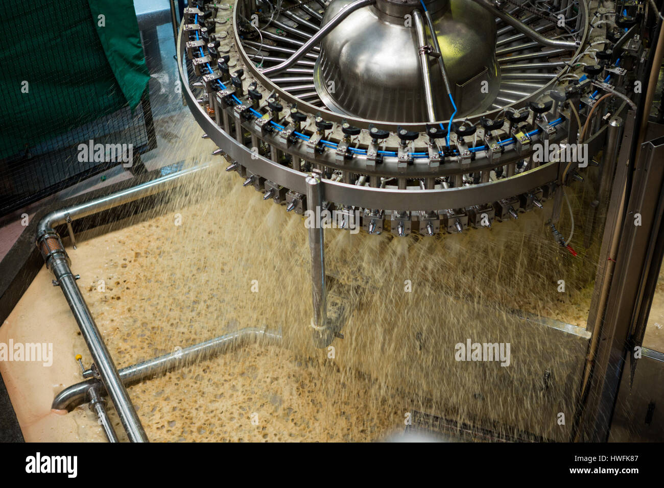 High angle view of processing machine in juice factory Stock Photo - Alamy