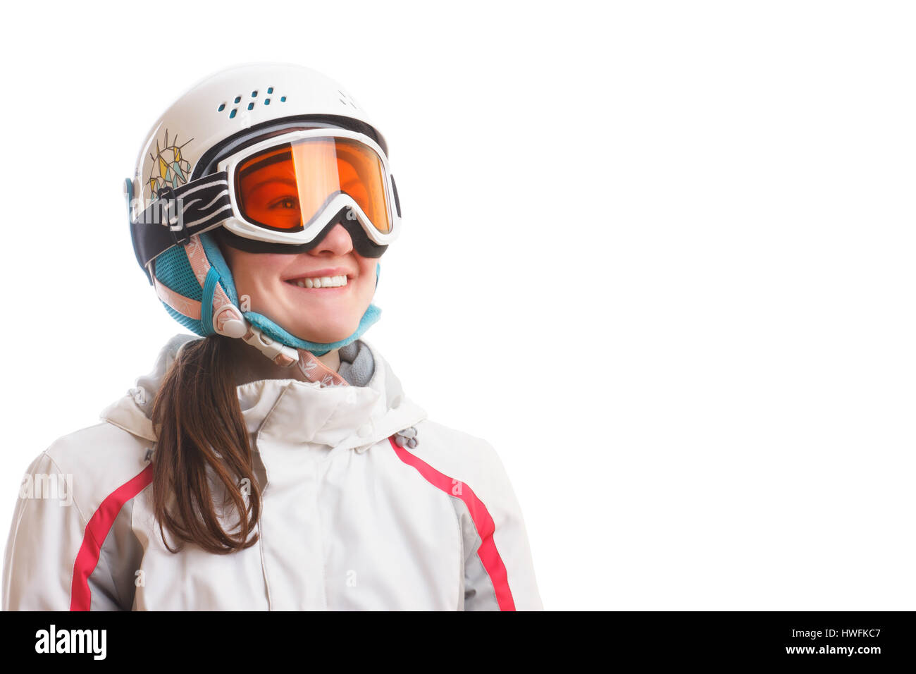 Young girl snowboarder in helmet and glasses looks up and smiles Stock Photo - Alamy