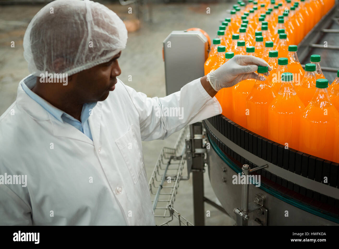 Serious male worker examining hi-res stock photography and images - Alamy