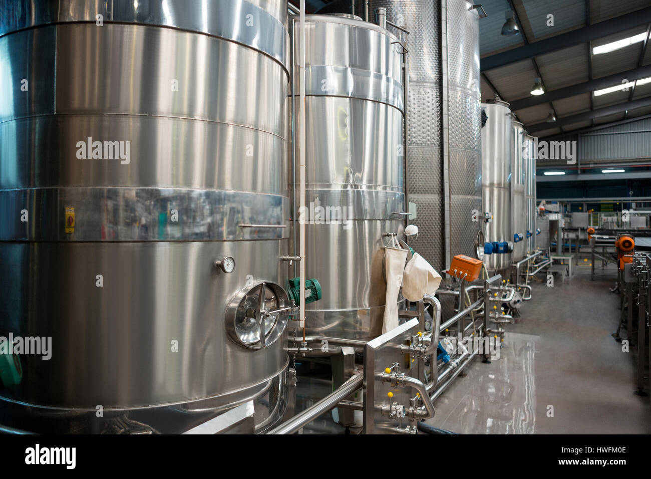 Storage tanks and machinery in juice factory Stock Photo - Alamy