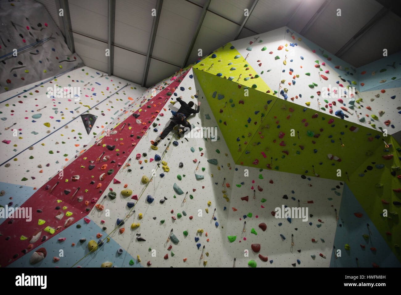 Rock climbing wall young man hi-res stock photography and images - Alamy
