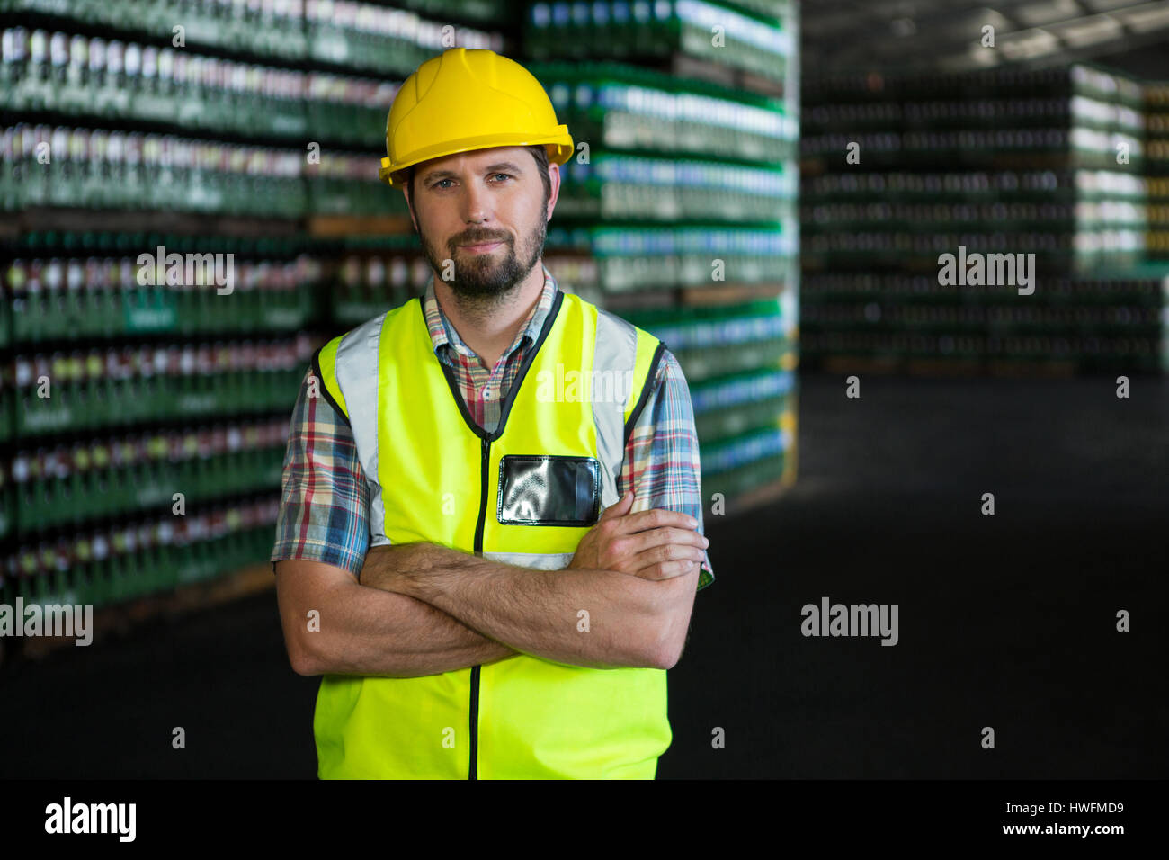 Portrait of young male worker standing in warehouse Stock Photo - Alamy