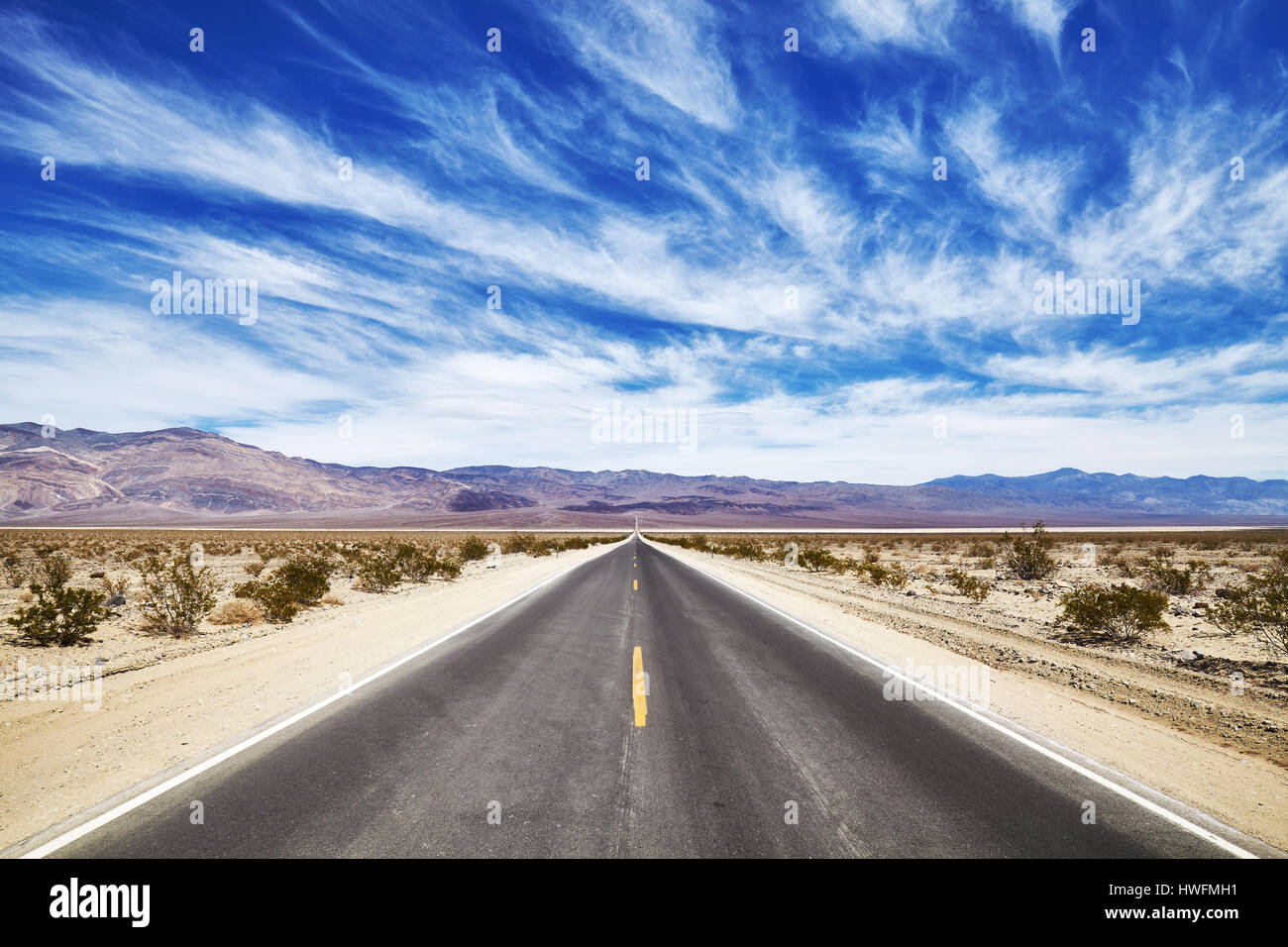 Endless desert road in the Death Valley, travel concept, USA Stock ...