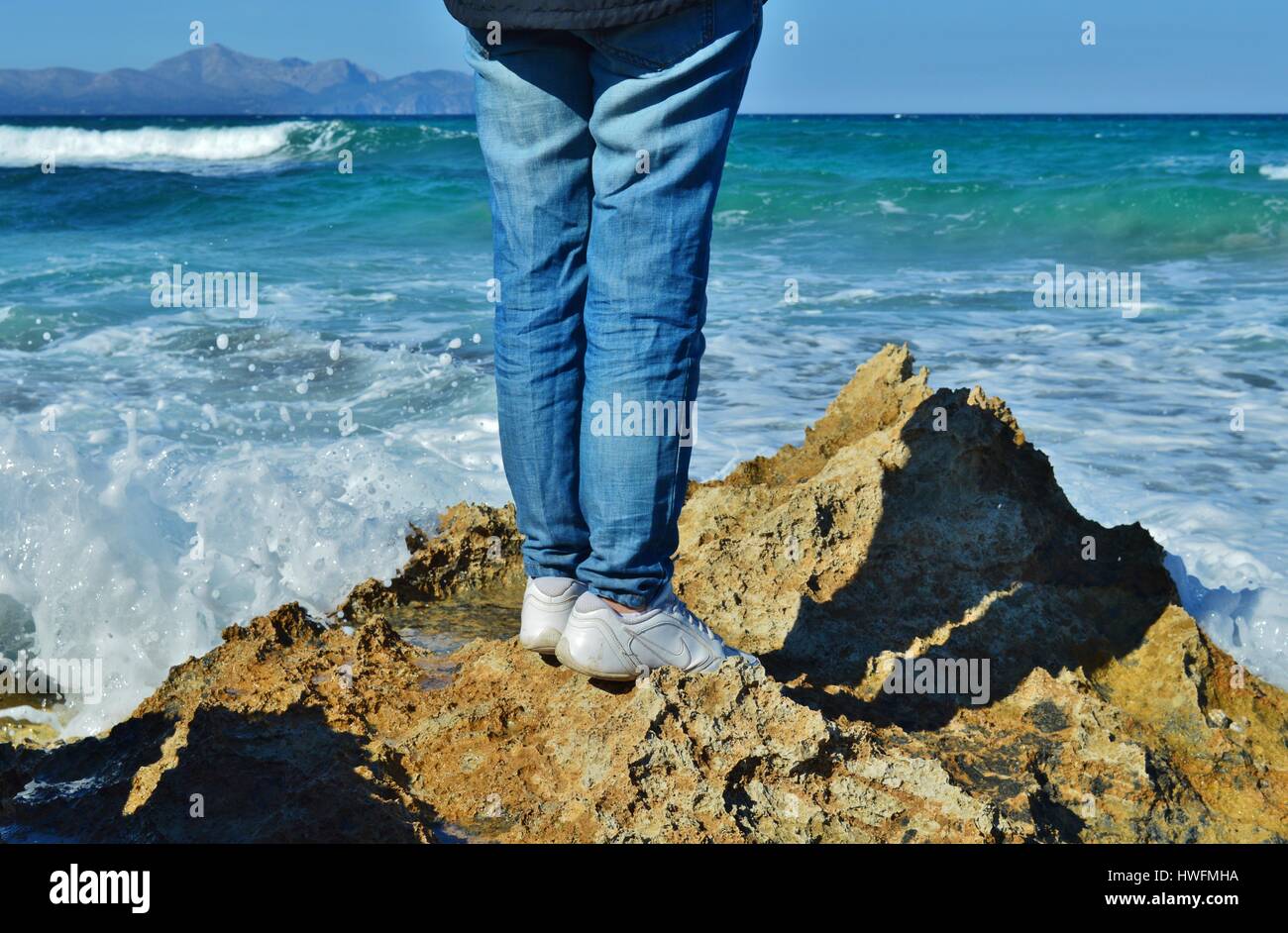 A woman against a wave Stock Photo - Alamy
