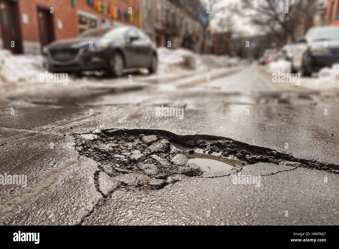 Large pothole in Montreal, Canada Stock Photo - Alamy