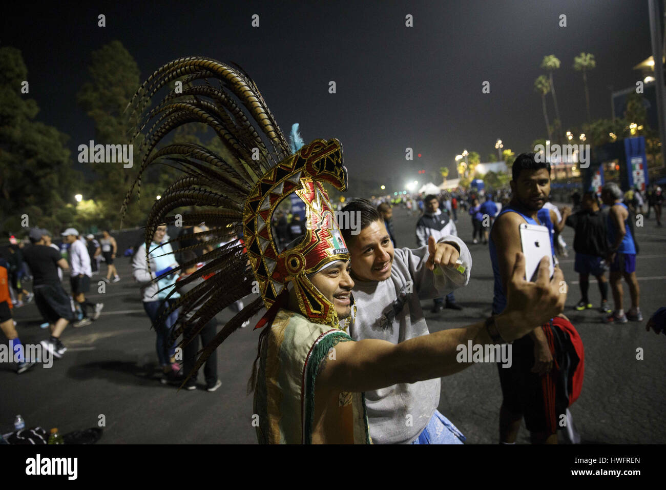 Los Angeles, CA, USA. 19th Mar, 2017. Alberto Ortiz takes a photo ...