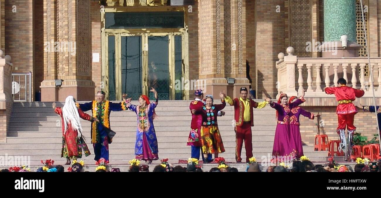 Hami, China. 20th Mar, 2017. Uygur people perform dancing in Hami ...