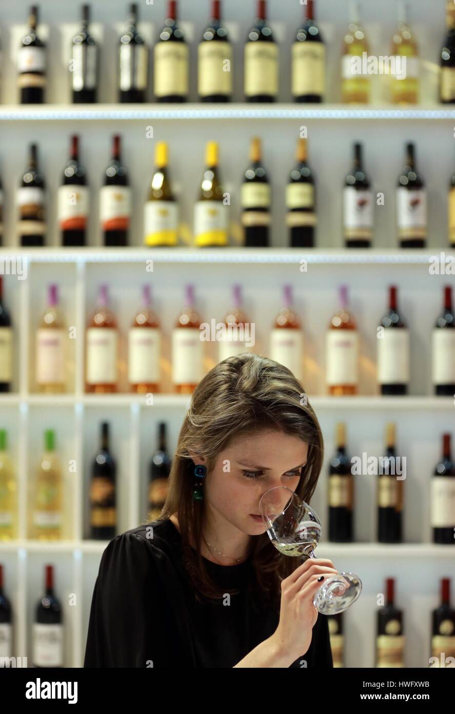 Dusseldorf, Germany. 20th Mar, 2017. A woman tastes a glass of Changyu ...