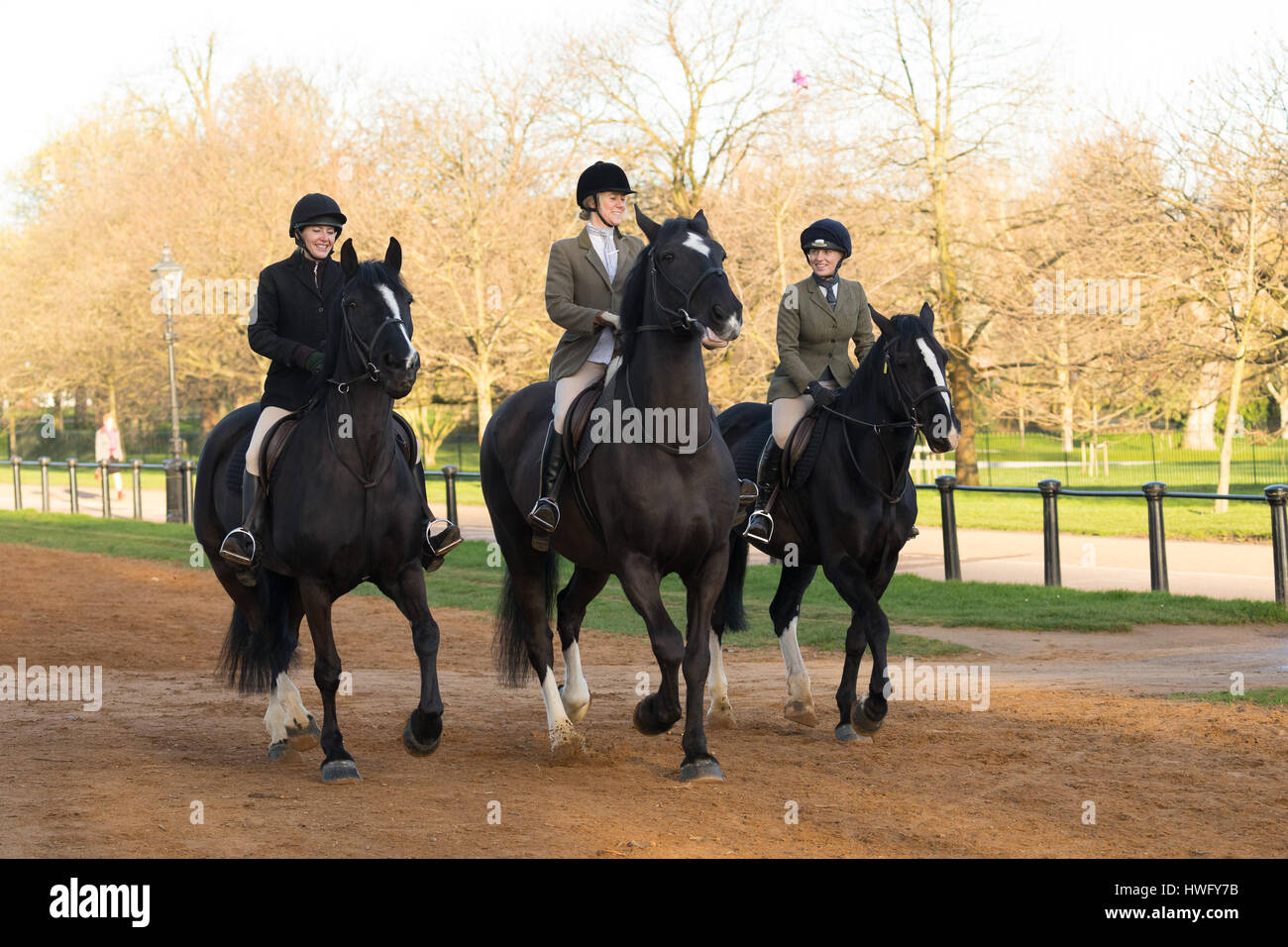 London, UK. 21st Mar 2017. Three women ride horses in Hyde Park during ...