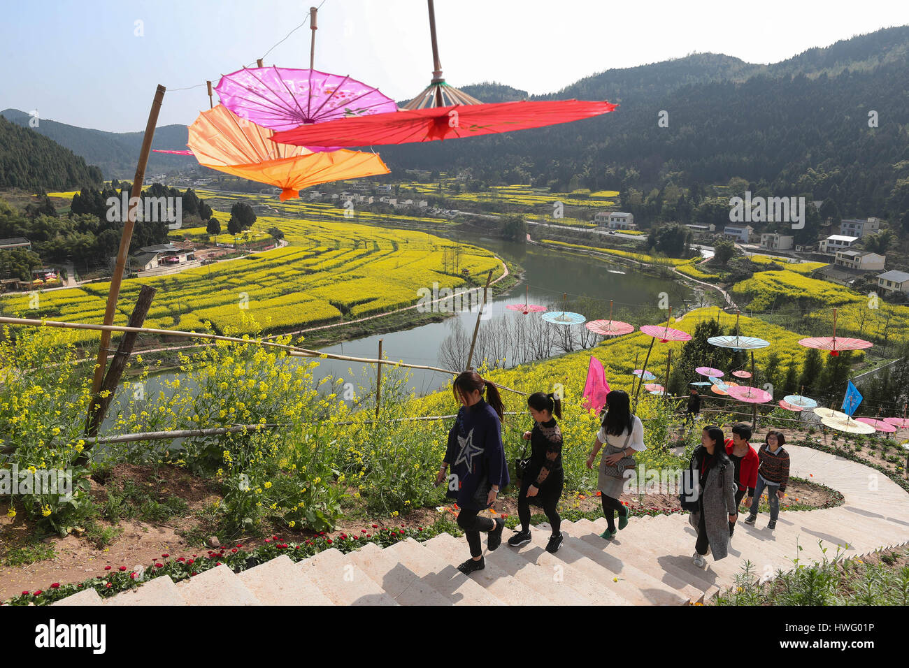 Chengdu, China. 20th Mar, 2017. Tourists walk in Sanyuan Township of ...