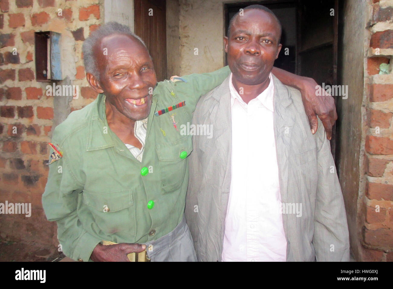 World War II veteran Elismus Katende (l), wearing his old uniform ...