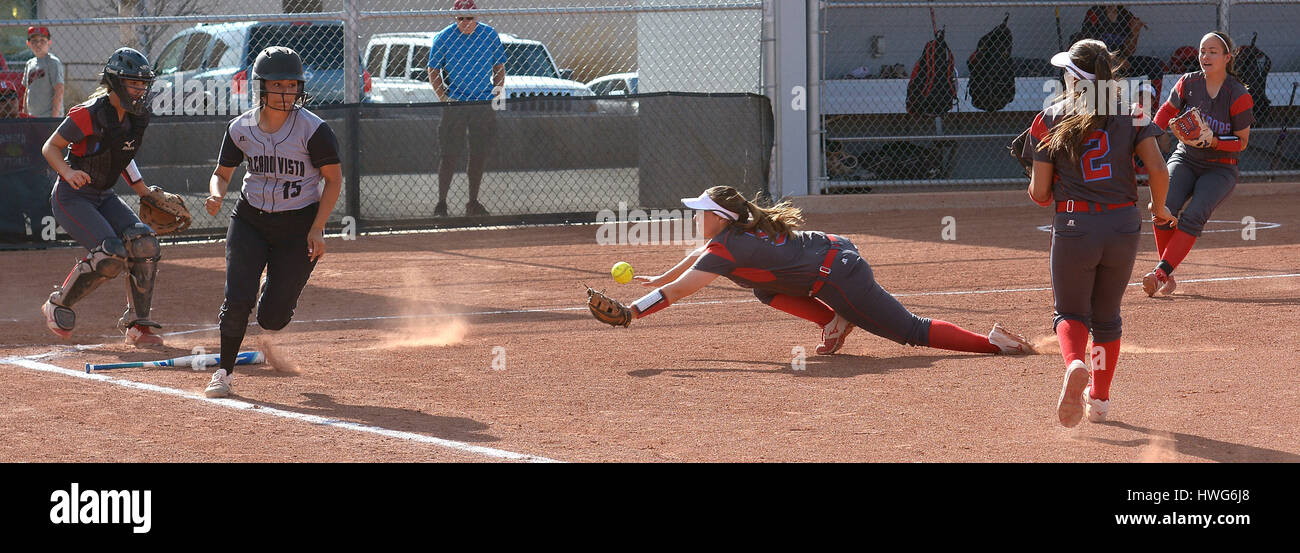 Usa. 21st Mar, 2017. SPORTS -- Sandia pitcher Victoria Reyes dives for ...