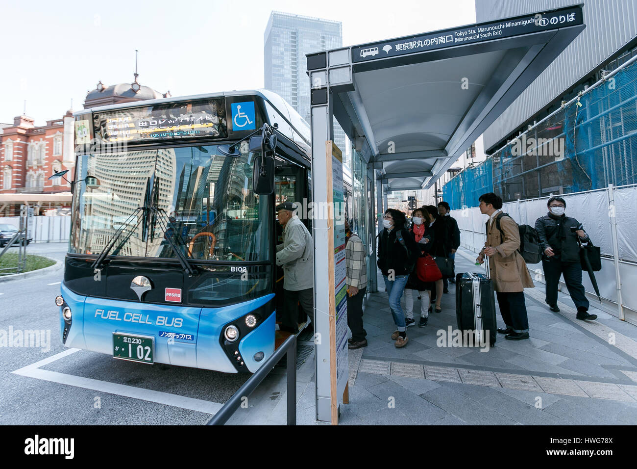 People enter a hydrogen fuel cell bus at Tokyo Station on March 22 ...