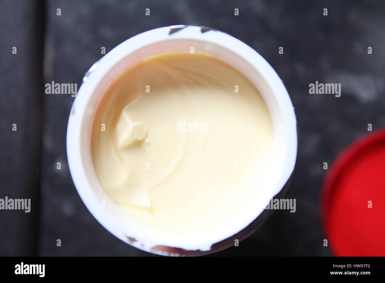 Taking the foil of an untouched, premade icing packet to use in a ...