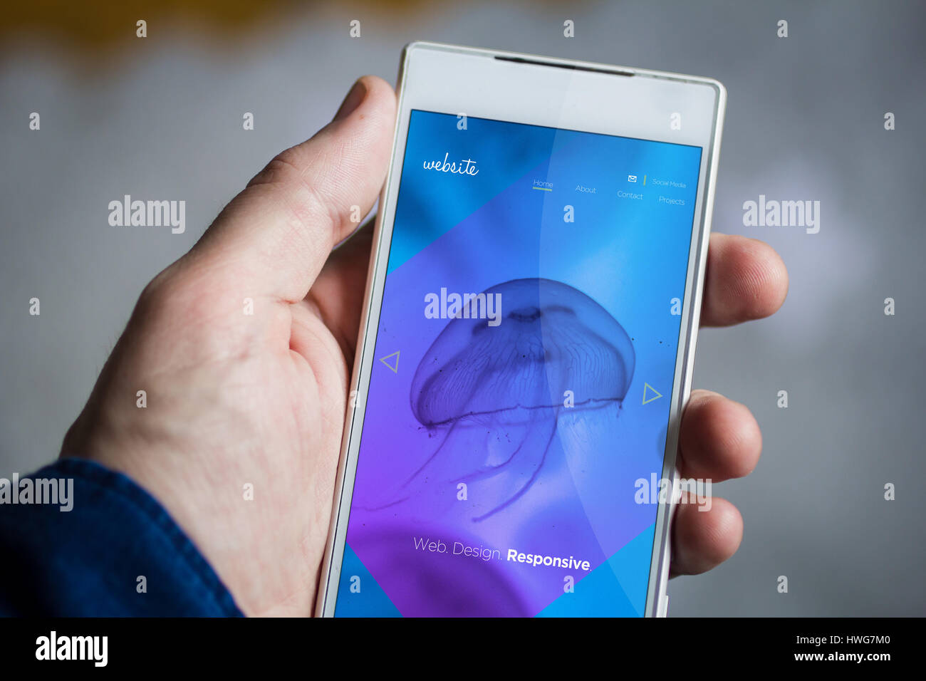man hand holding mobile design smartphone. All screen graphics are made ...