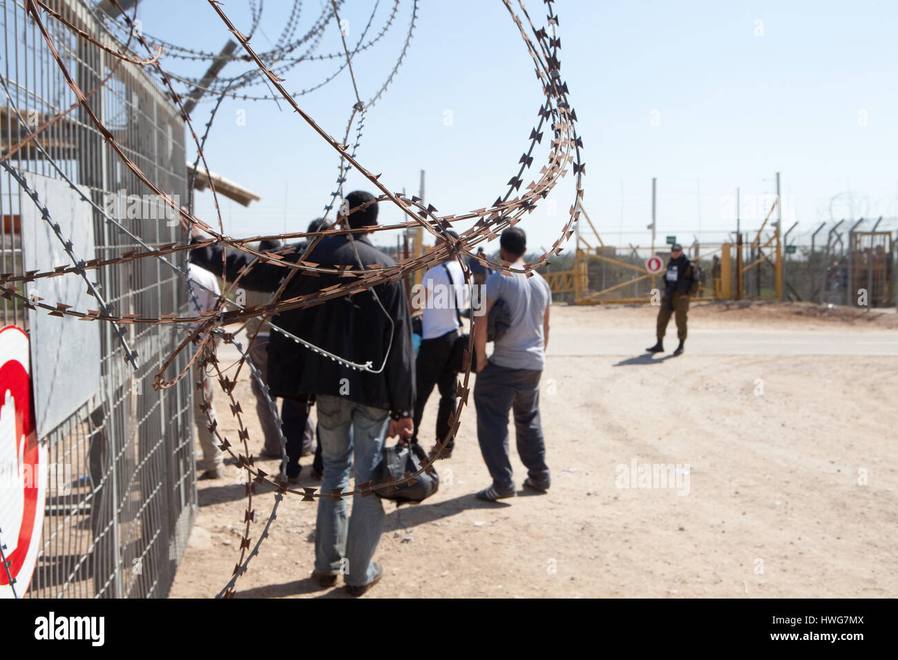Palestinians and soldier at Checkpoint of Separation Barrier in Israeli ...